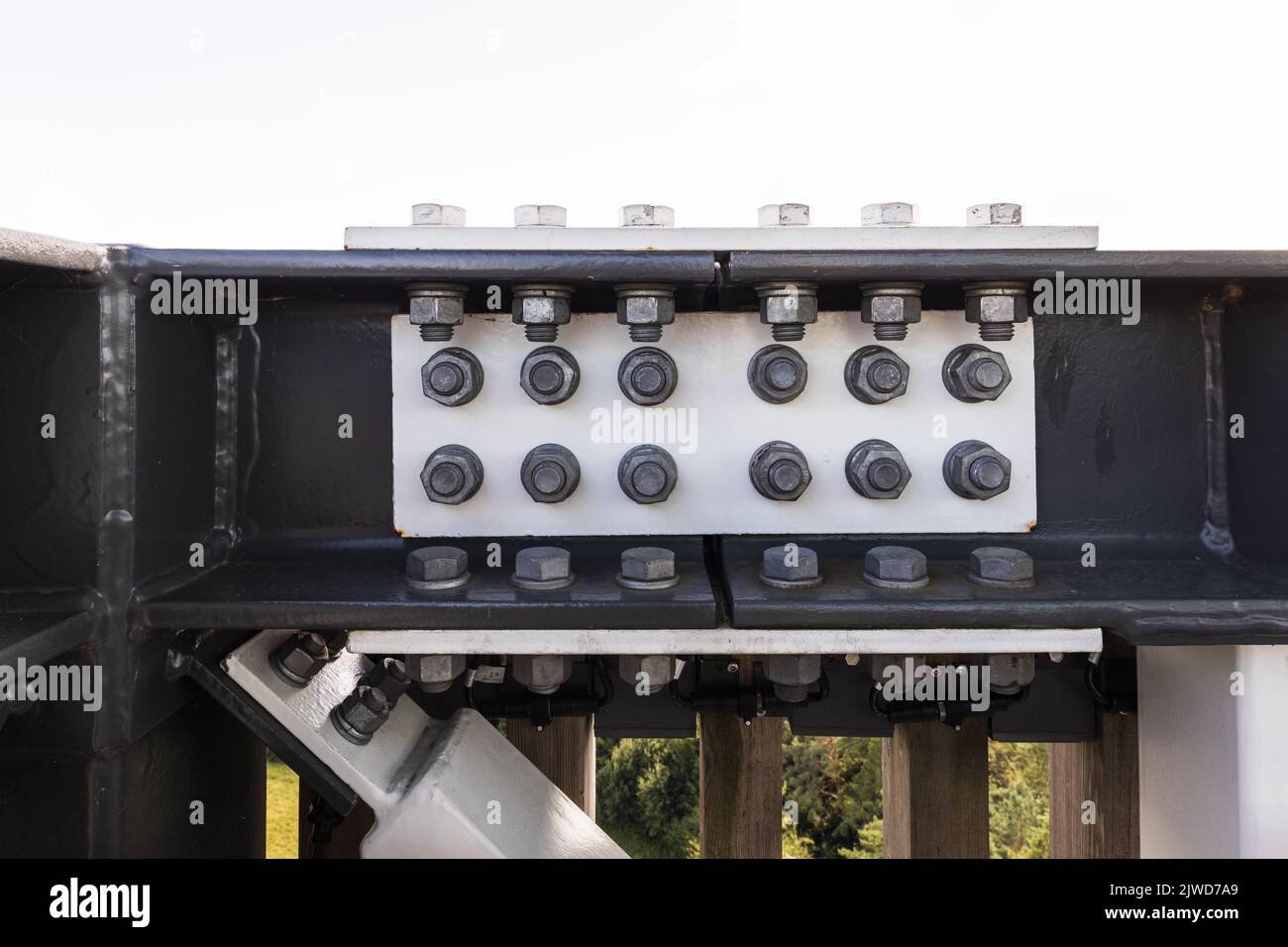 Part of a massive metal structure with bolts and rivets at the steel ...