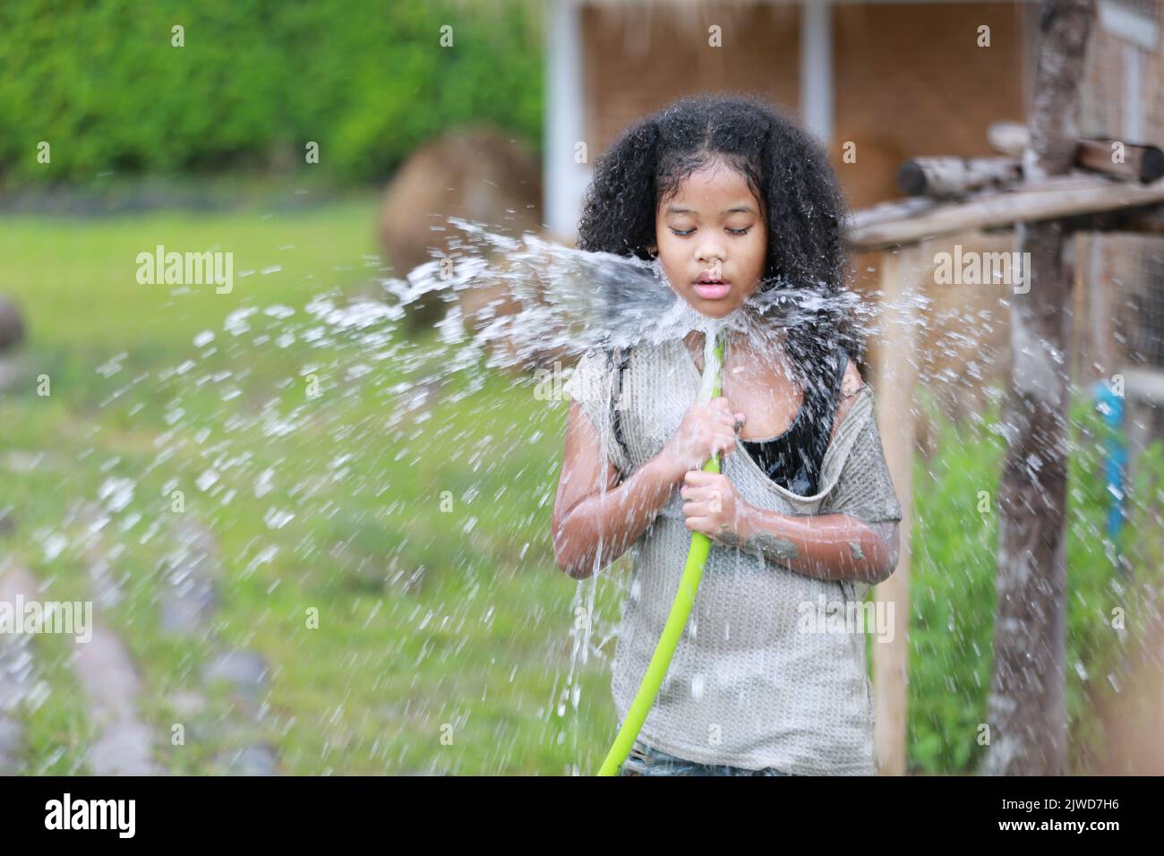 Group of kids playing on muck in the raining day Stock Photo - Alamy