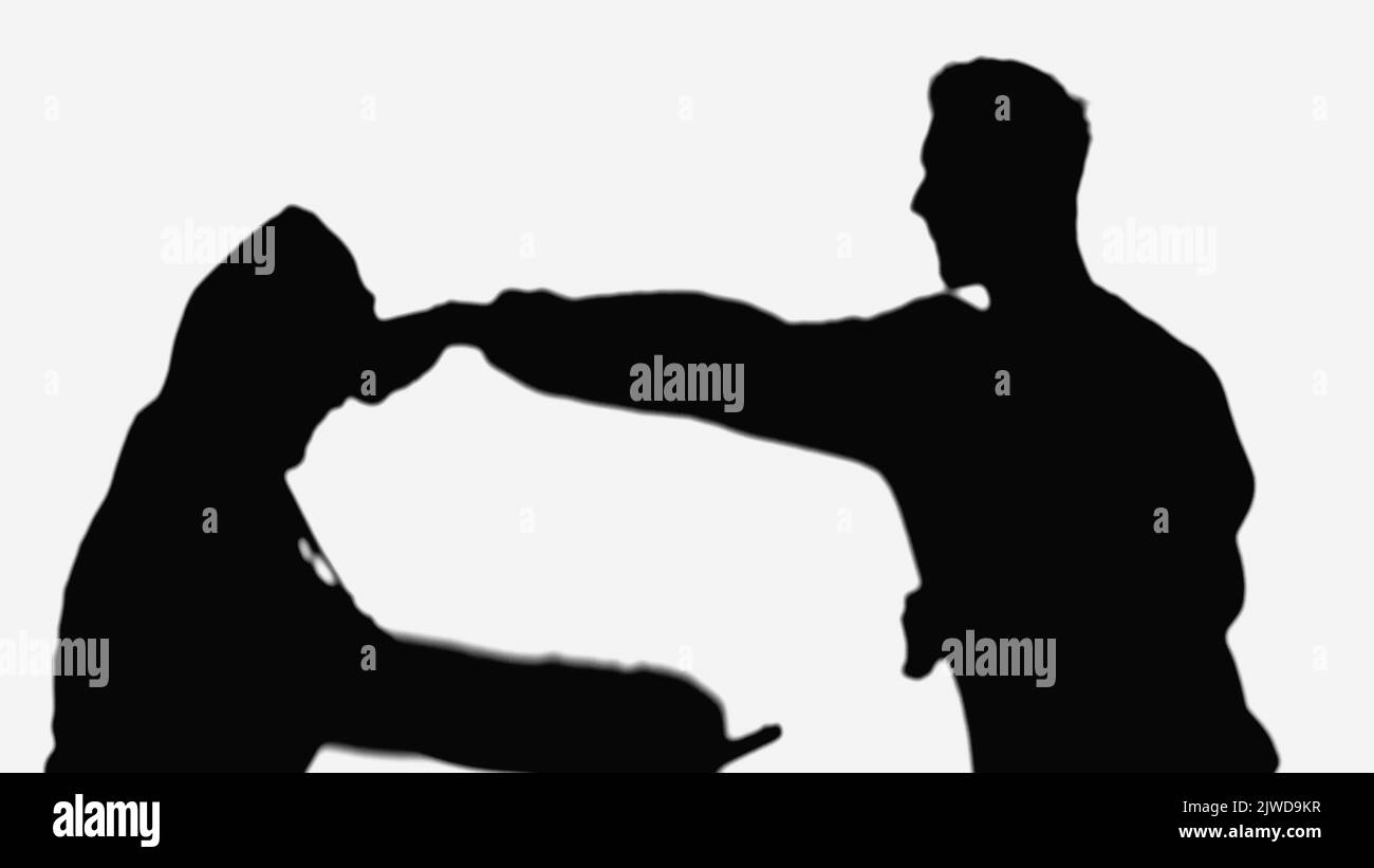 shadow of man punching robber in hood isolated on white Stock Photo - Alamy