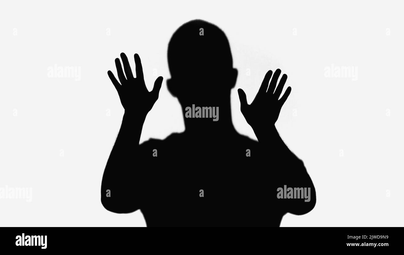 black shadow of man waving hands isolated on white Stock Photo - Alamy