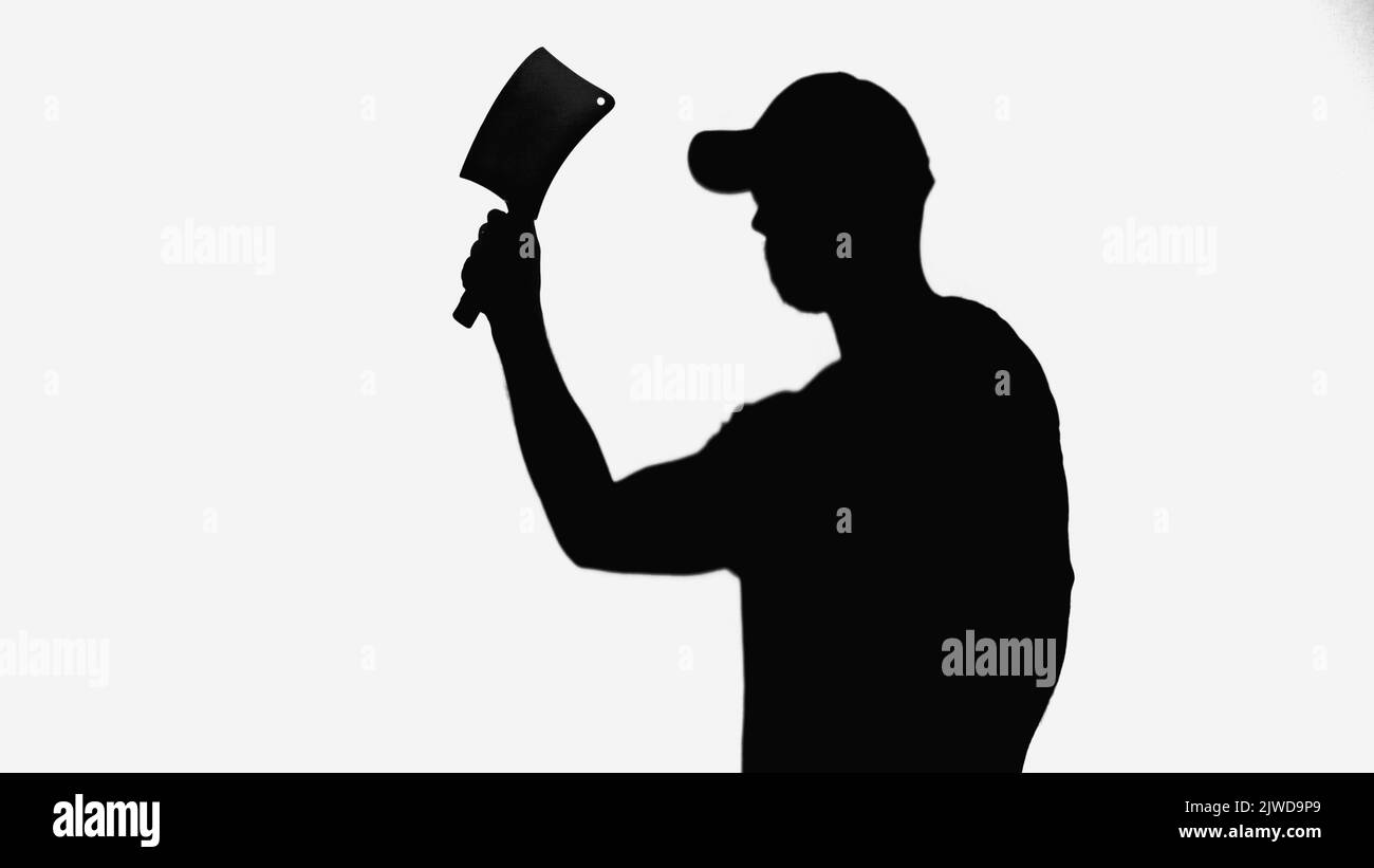silhouette of butcher in cap holding cleaver isolated on white Stock ...