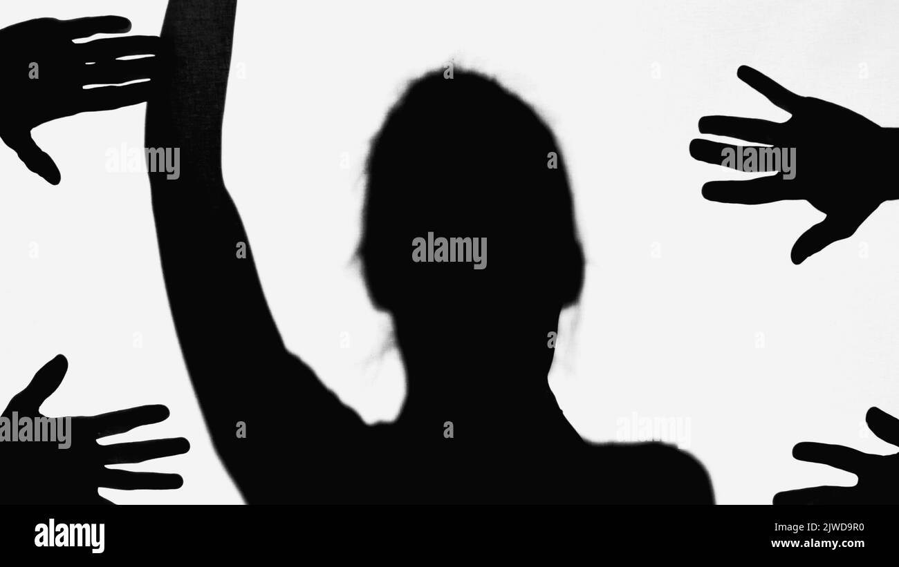 silhouette of woman with arm up near hands of people isolated on white ...