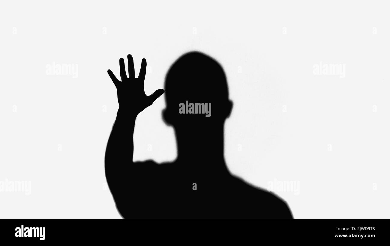 Silhouette man waving hi-res stock photography and images - Alamy