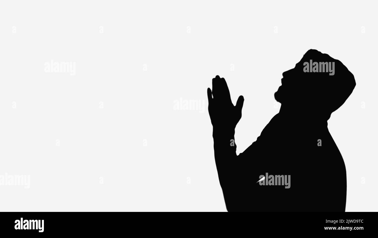 black shadow of man with praying hands isolated on white Stock Photo ...
