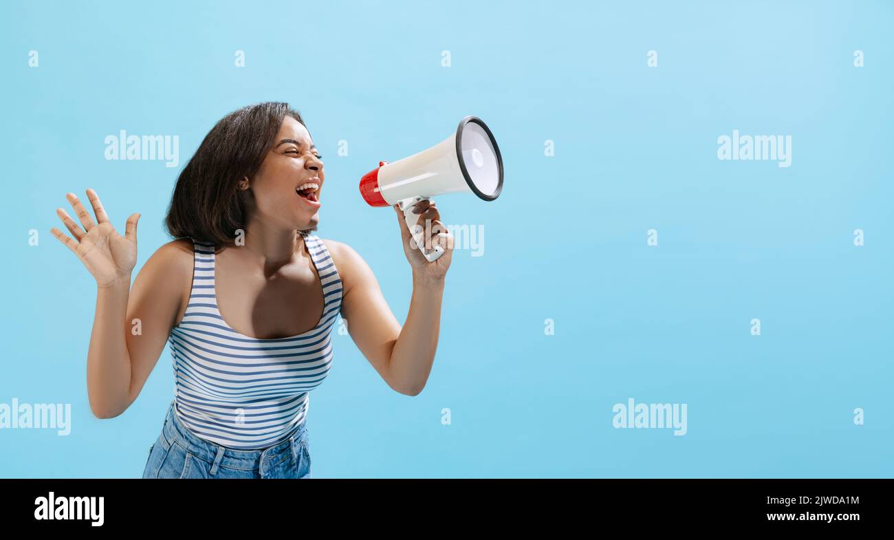Excited young girl, student wearing casual style clothes shouting at ...