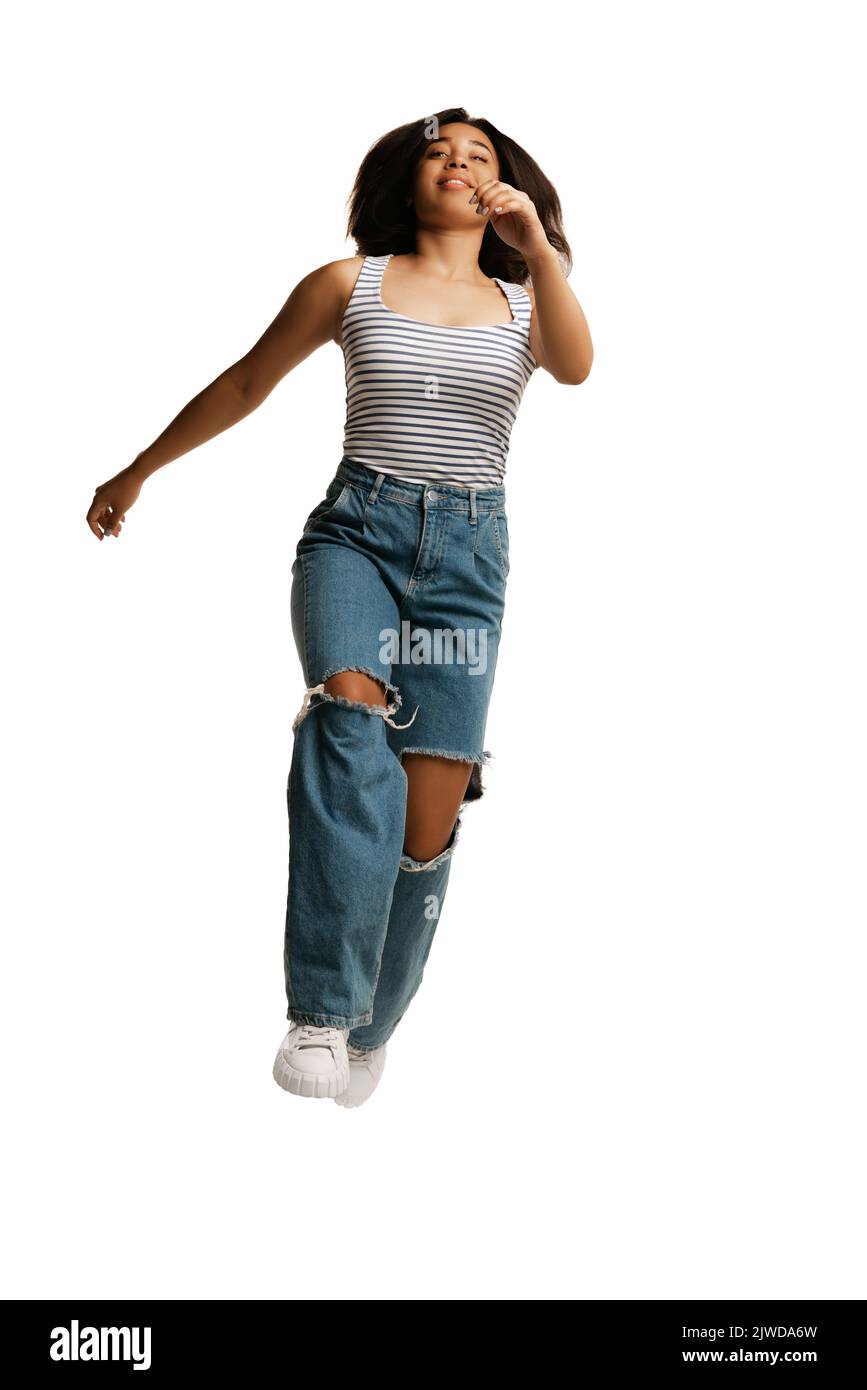 Cheerful young girl, student running isolated on white background ...