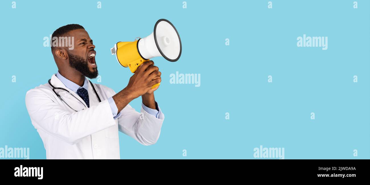 Medical News. Angry black male doctor in uniform screaming with ...