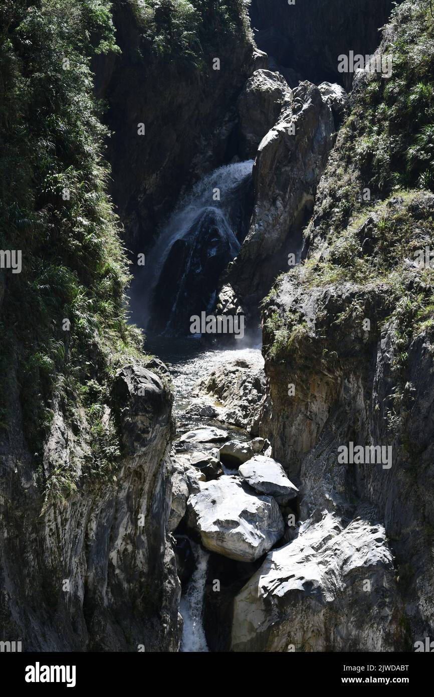 A vertical of a waterfall and ravine at Tianxiang recreation area in ...
