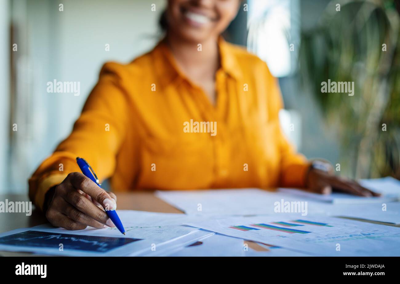 Female business analyst hands writing on papers, making notes and ...