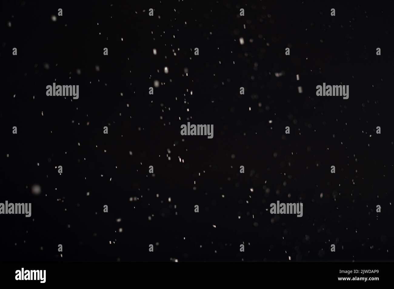snow background defocused white flying dust black Stock Photo - Alamy