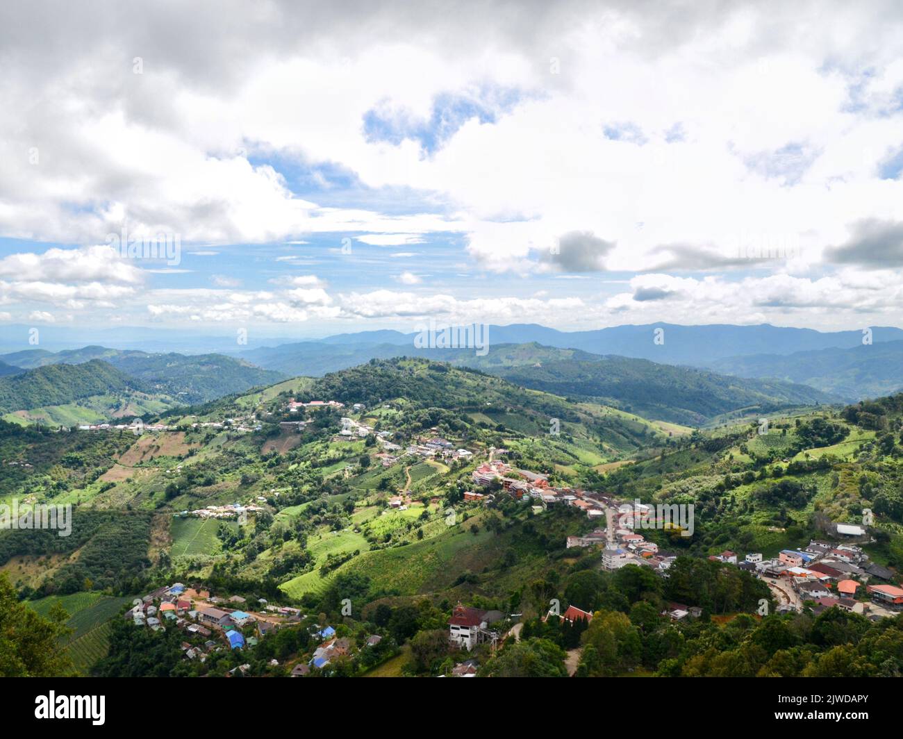 A bird's eye view of a suburban town in a beautiful valley surrounded ...