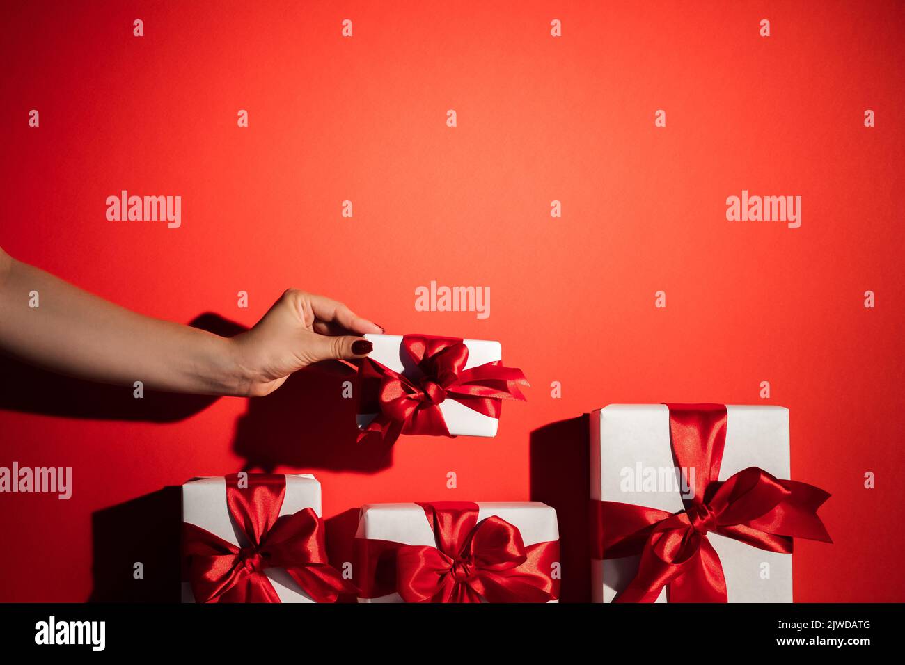 new year present christmas greeting hand gifts red Stock Photo - Alamy