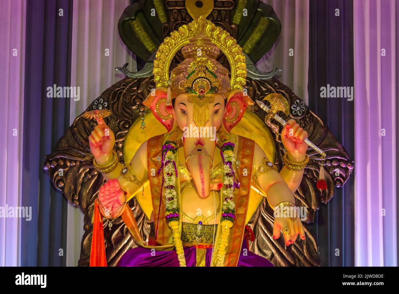 A beautiful idol of Lord Ganesha being worshipped at a mandal in Mumbai ...