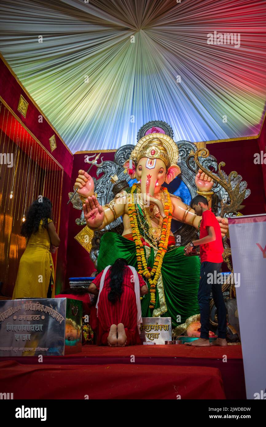 A beautiful idol of Lord Ganesha being worshipped at a mandal in Mumbai ...