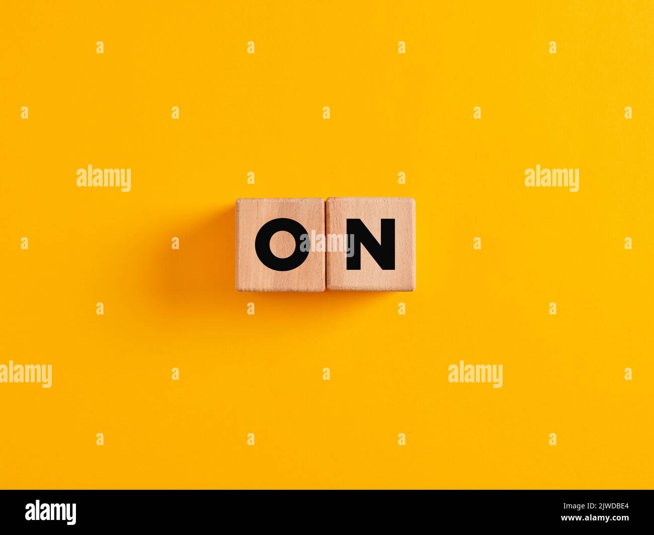 The word off on wooden cubes on yellow background. To end or to close ...