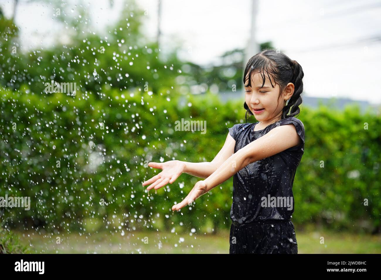 Group of kids playing on muck in the raining day Stock Photo - Alamy