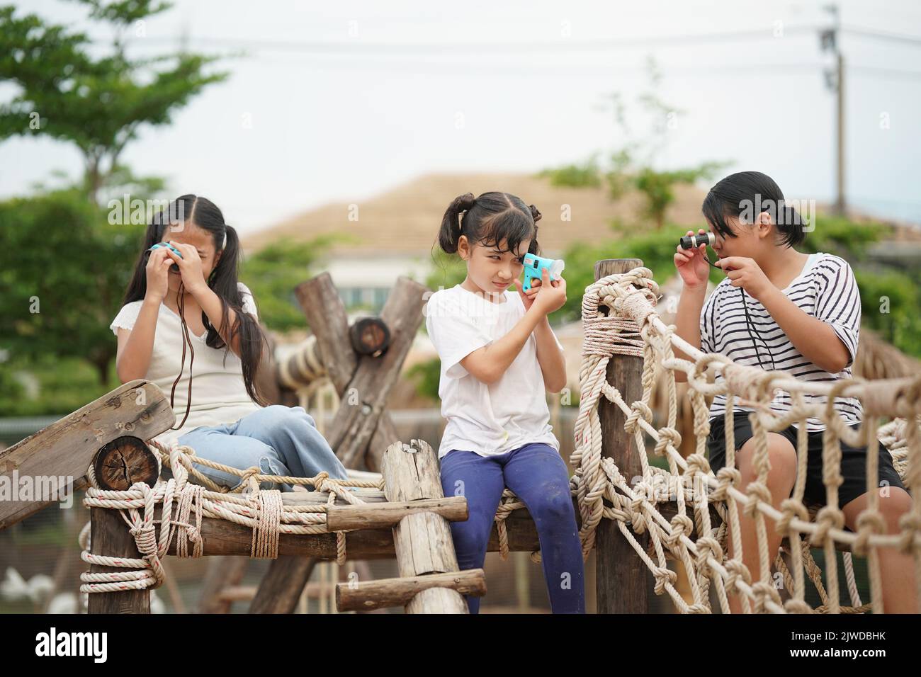 Group of happy children playing at playground Stock Photo - Alamy