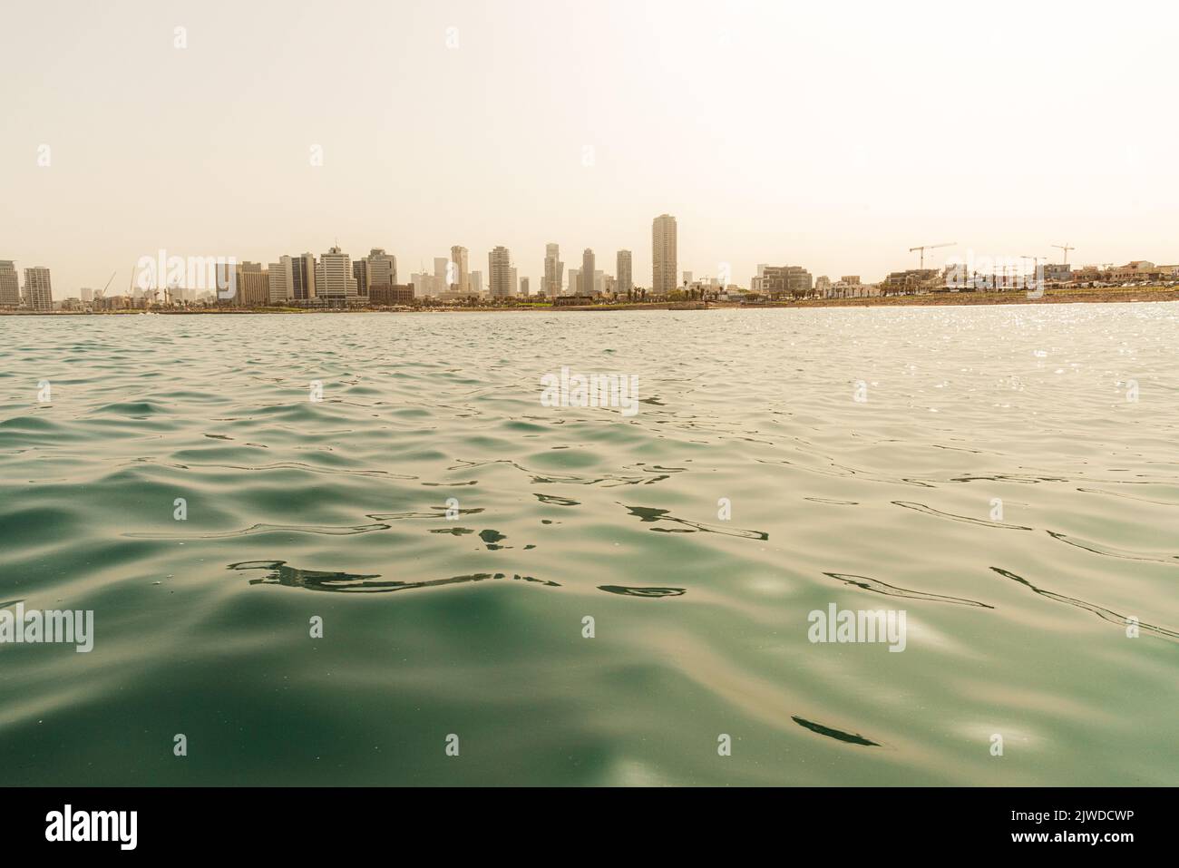 Tel Aviv skyline. A view from the water of the old Yaffa Port. High ...