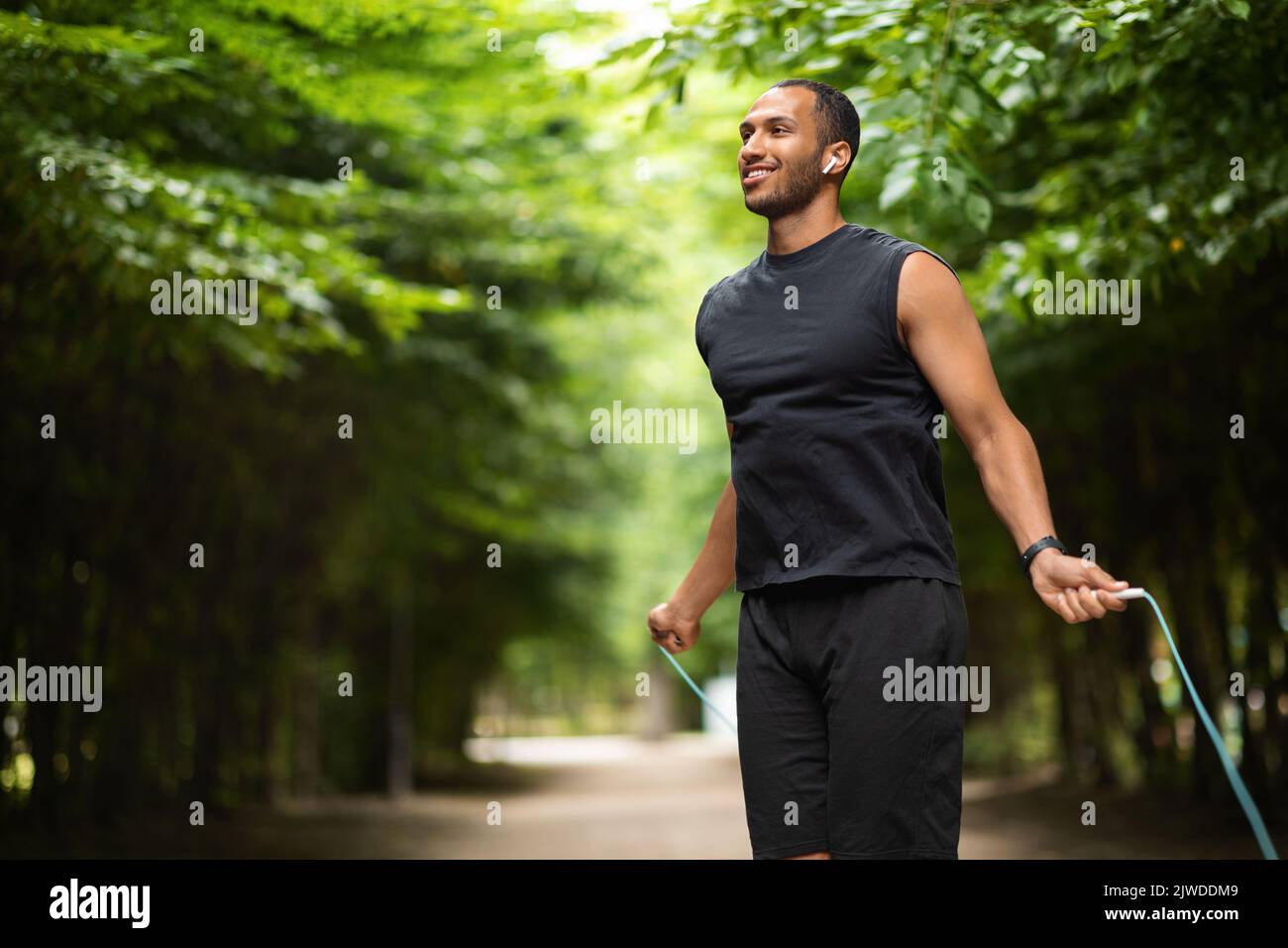 Young man jumping jogging in hi-res stock photography and images - Alamy