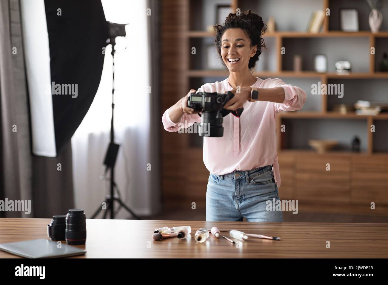 Young woman famous beauty blogger taking photo of cosmetics Stock Photo ...