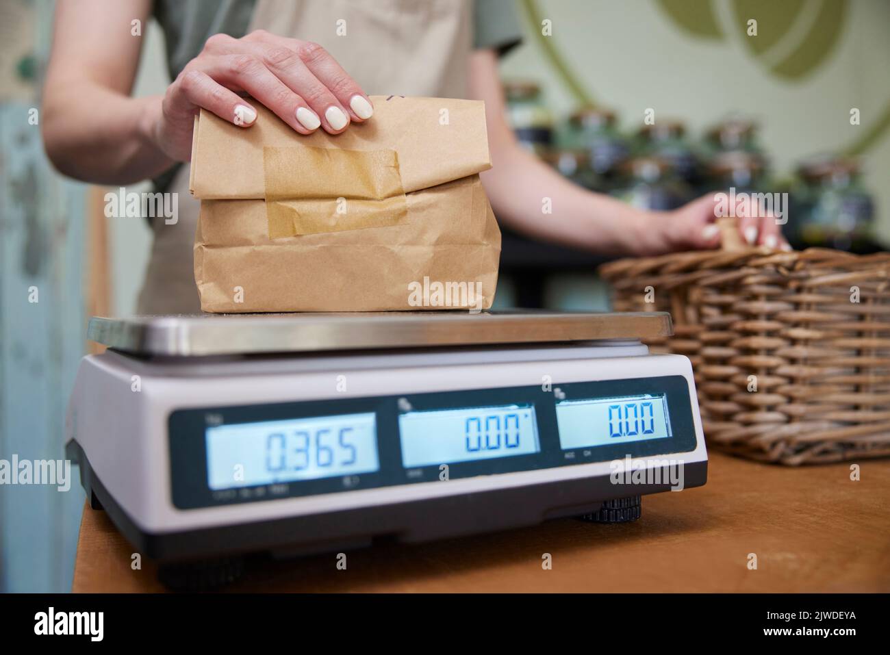 Close Up Of Sales Assistant In Sustainable Plastic Free Grocery Store ...