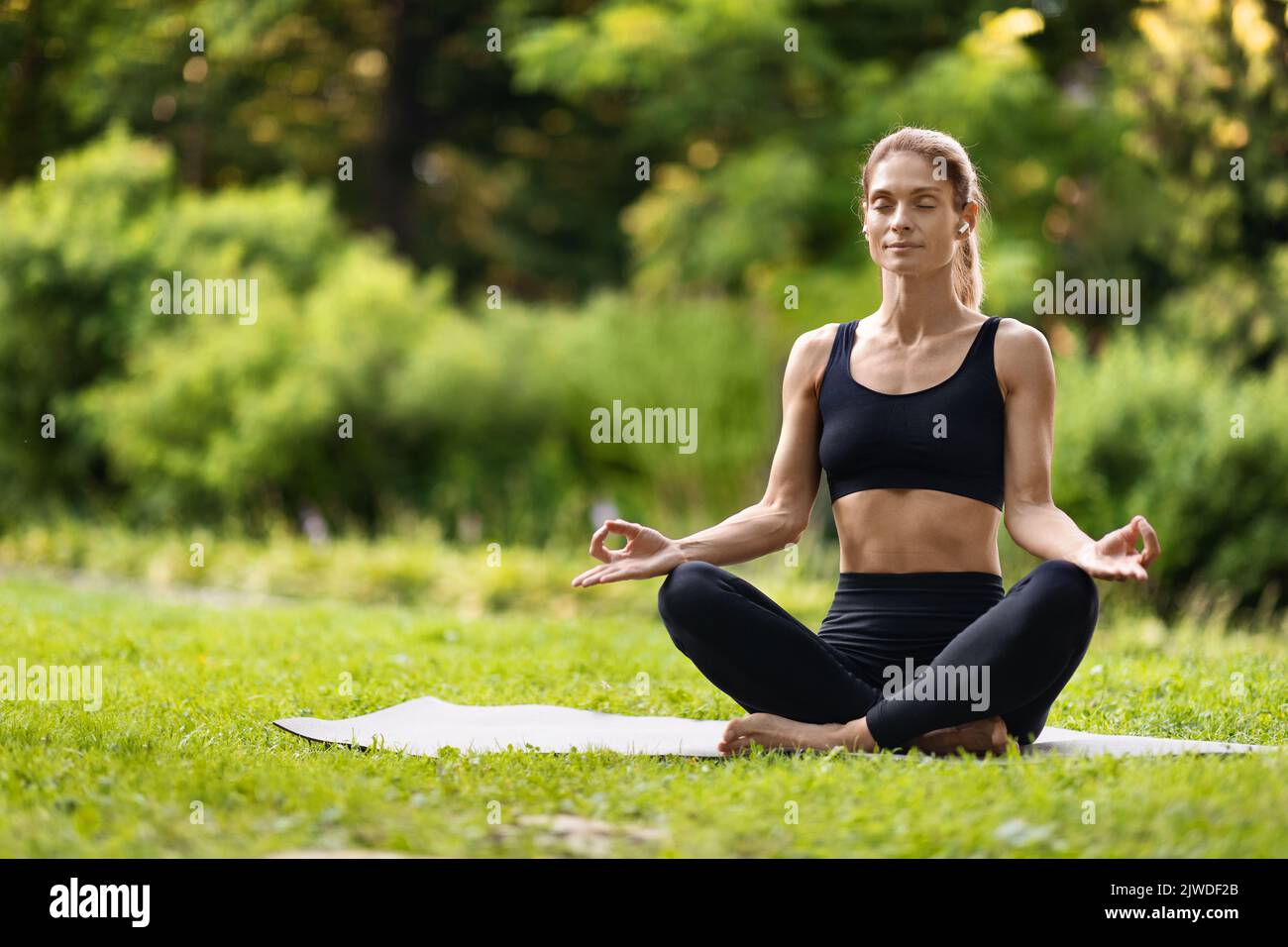 Adult sporty lady practicing yoga hi-res stock photography and images ...