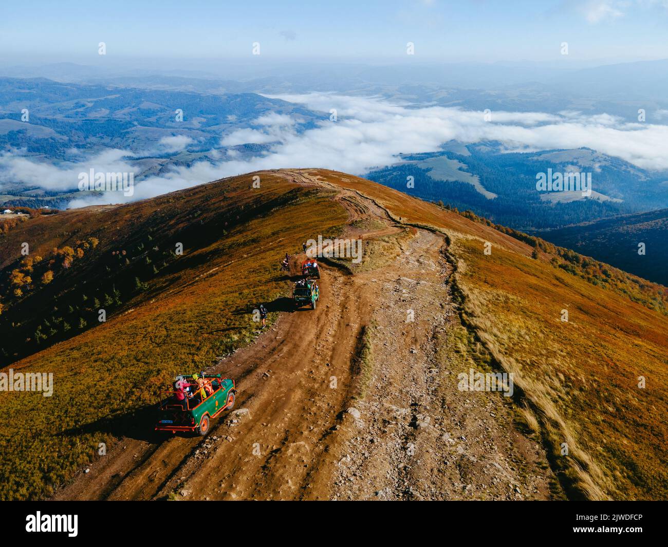aerial view of suv off road travel climbing up by mountain hill Stock ...