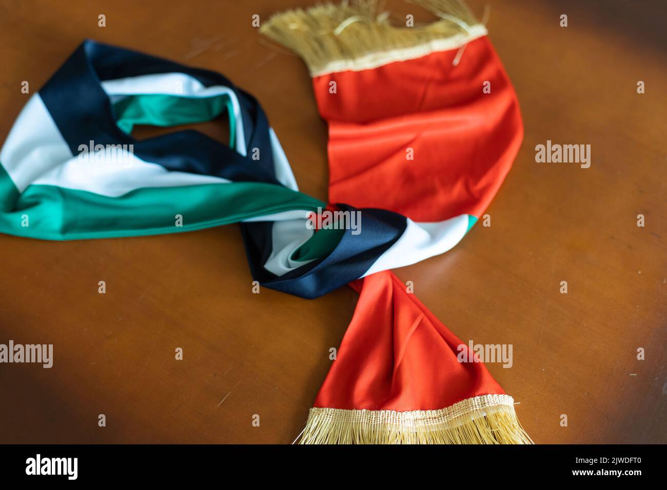 waving fabric texture of the flag with color of united arab emirates ...
