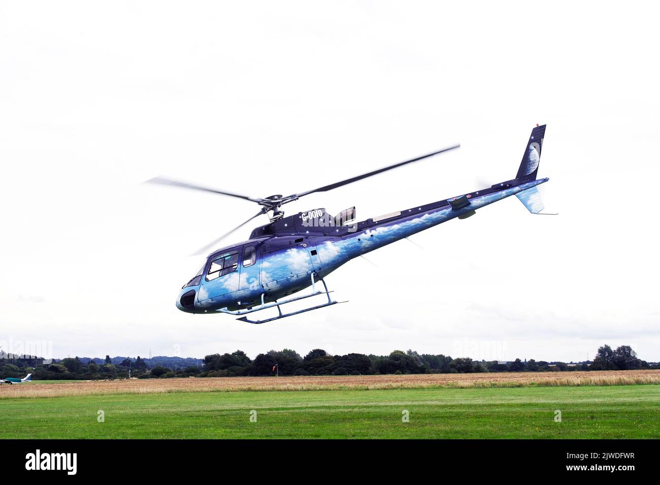 Helicopter in flight Stock Photo - Alamy