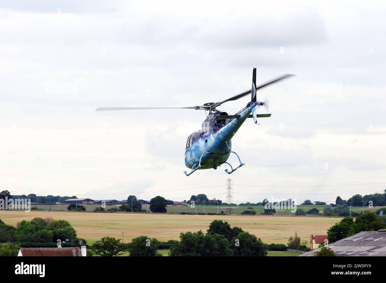 Helicopter in flight Stock Photo - Alamy