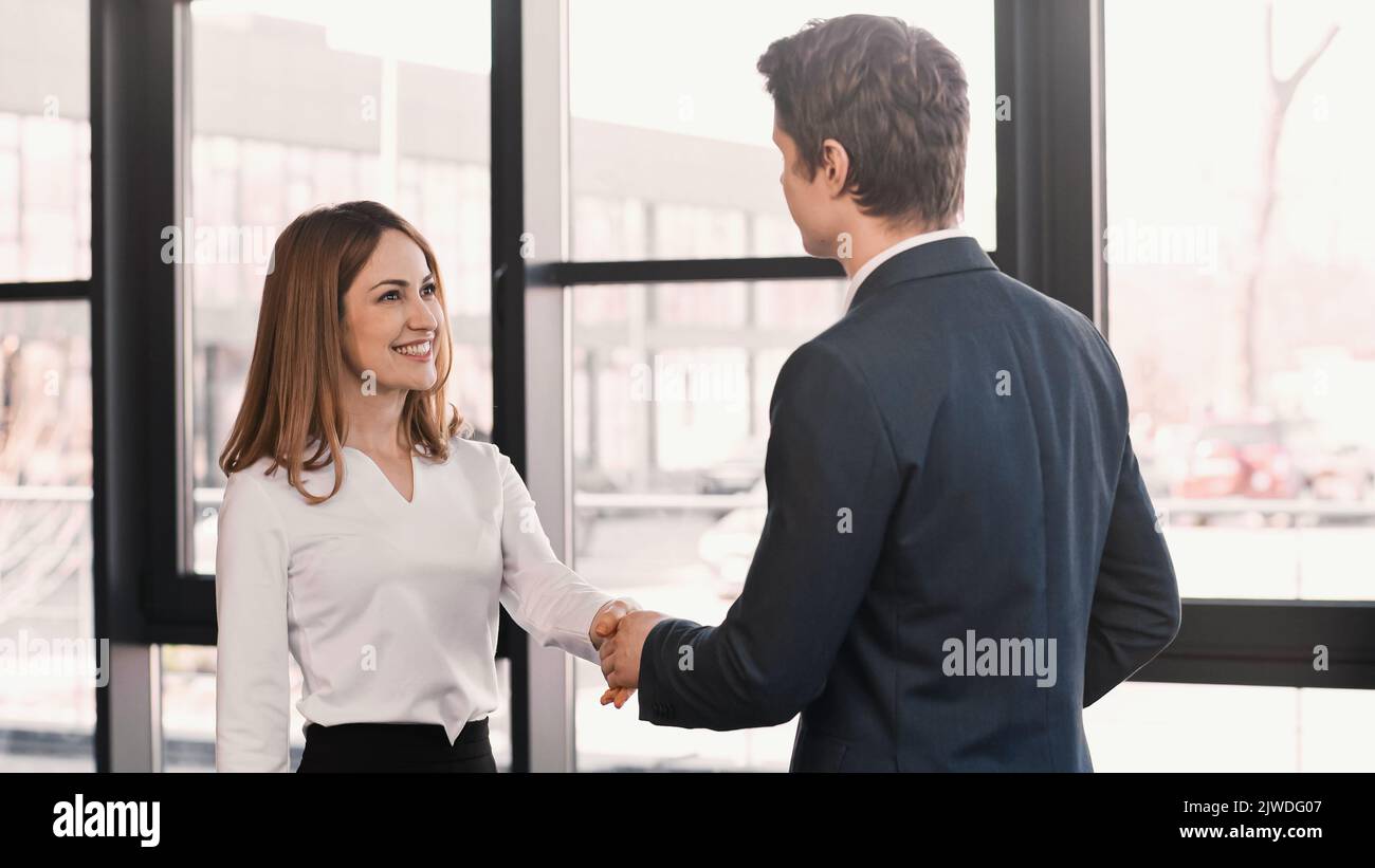 happy woman shaking hands with employer after job interview,stock image Stock Photo - Alamy