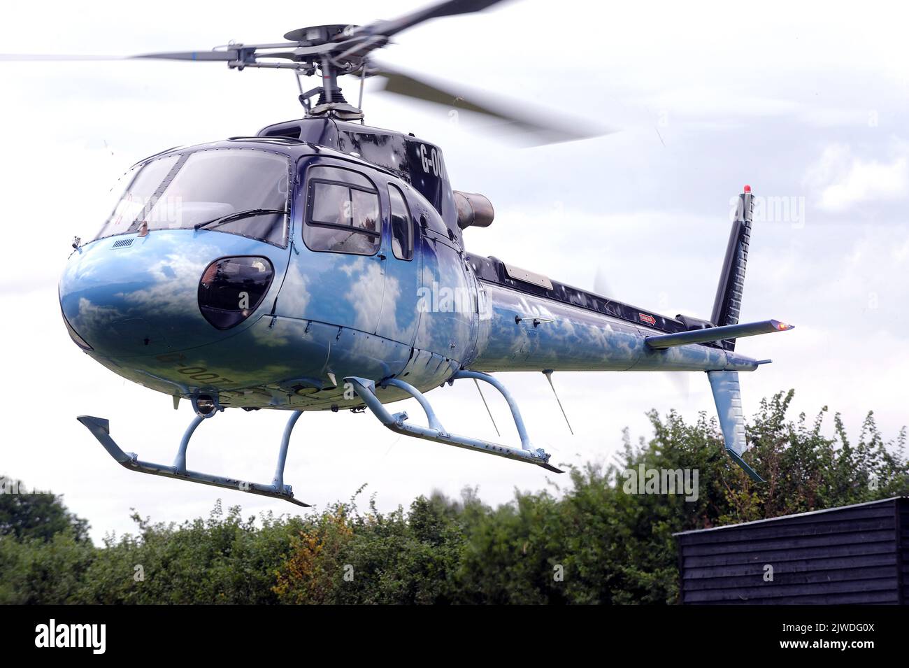 Helicopter in flight Stock Photo - Alamy