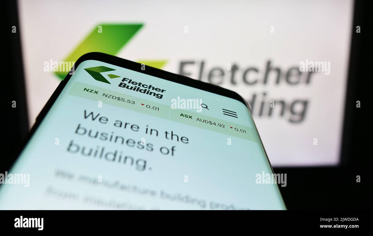 Mobile phone with webpage of construction company Fletcher Building ...