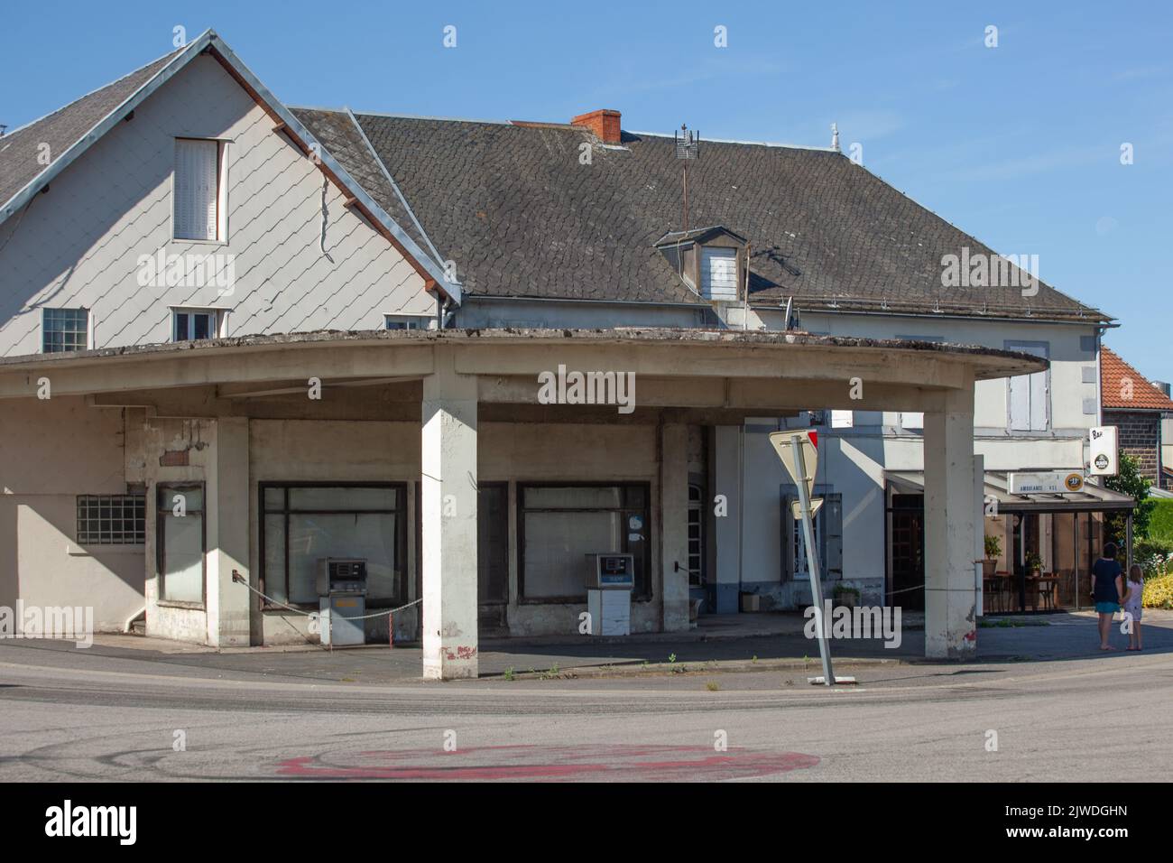 An old decommissioned petrol station is at the edge of a roundabout ...