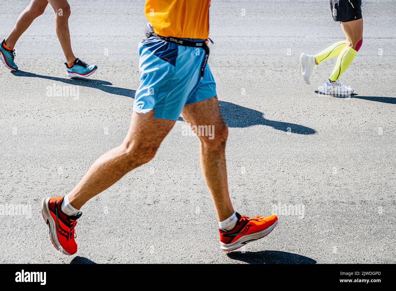 Ekaterinburg, Russia - August 7, 2022: legs male and female runners ...