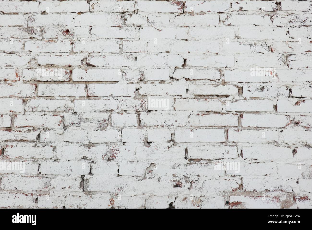 old brick wall white paint grunge background Stock Photo - Alamy