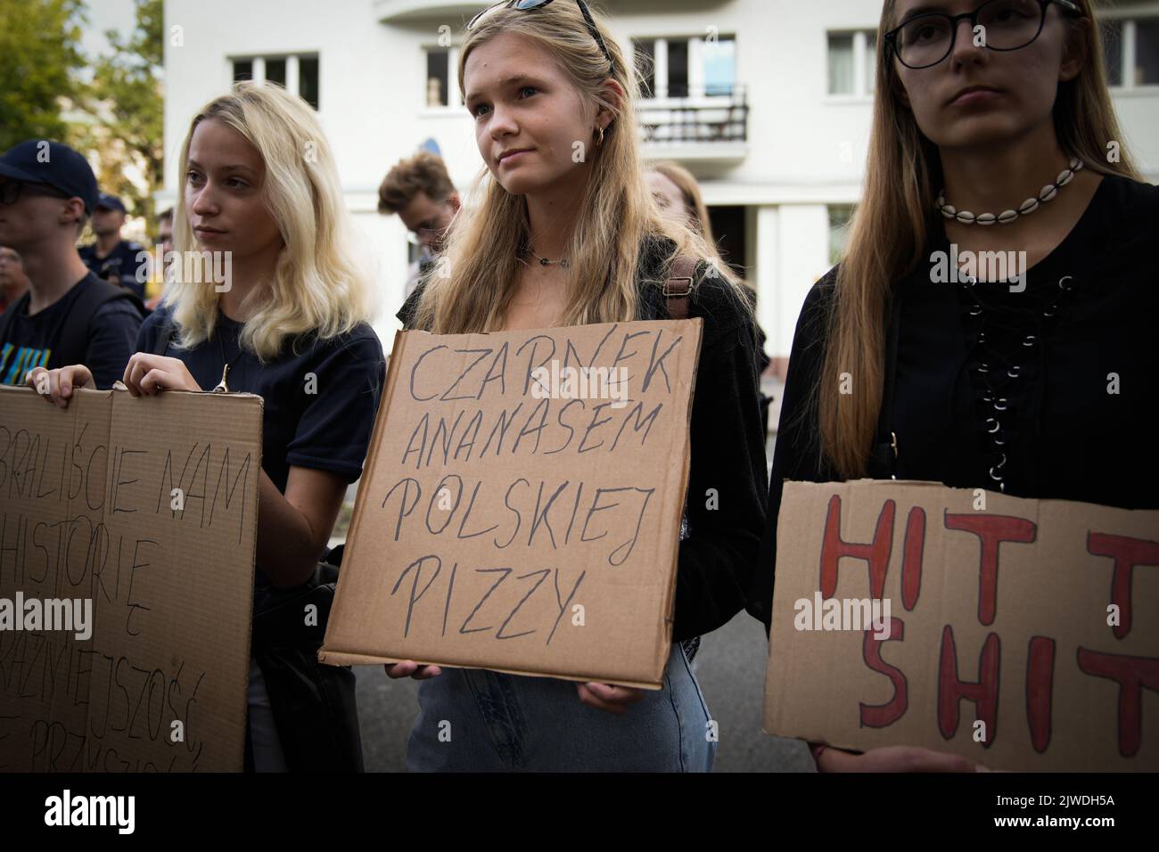 A student holds a sign with the words 'Czarnek is the pineapple of ...