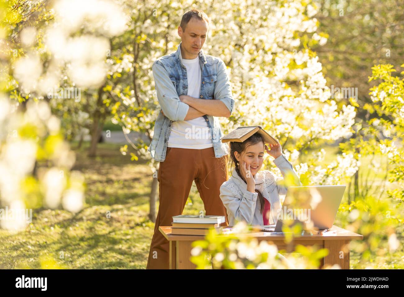 Homeschool young little girl learning, reading and does homework with ...