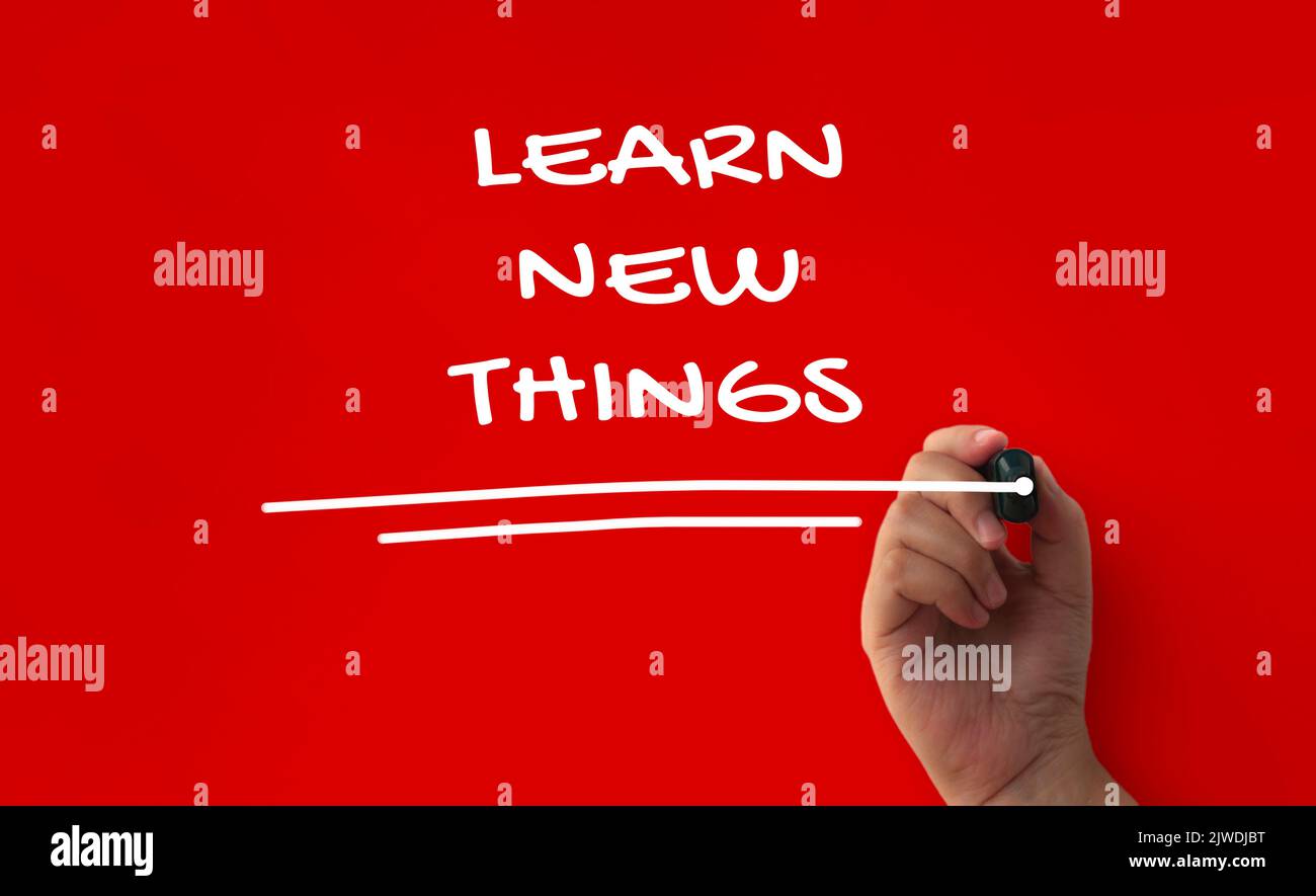 learn new things text written on red cover background. Inspirational ...