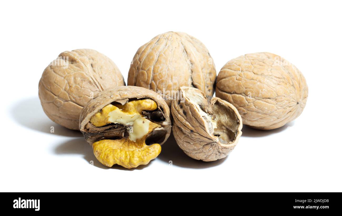Walnut kernel, peeled and unpeeled walnuts isolated on white background ...