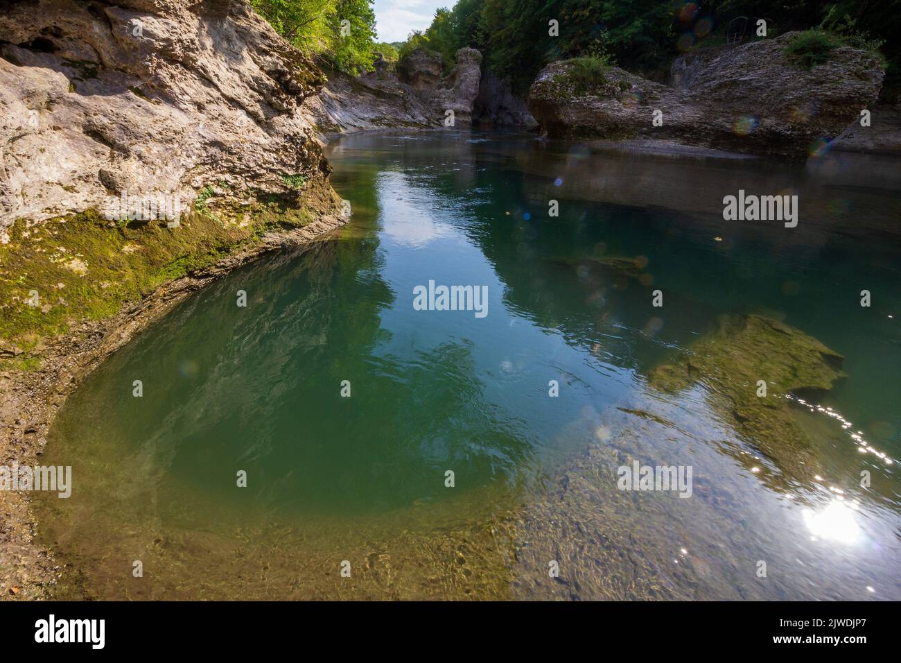 a beautiful landscape with a mountain river among the rocks of a ...