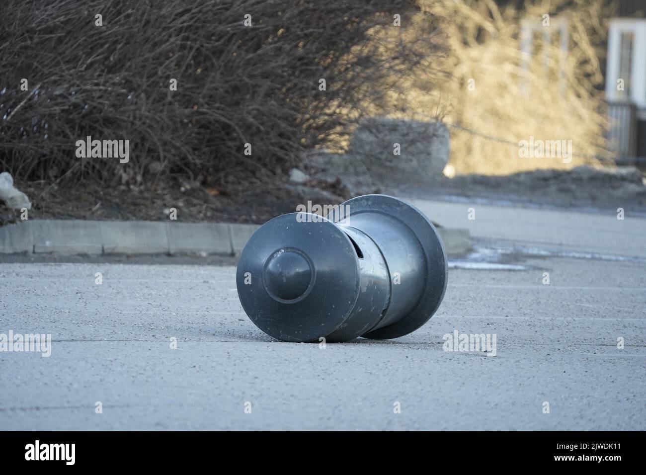The fallen trash can on the outside Stock Photo - Alamy