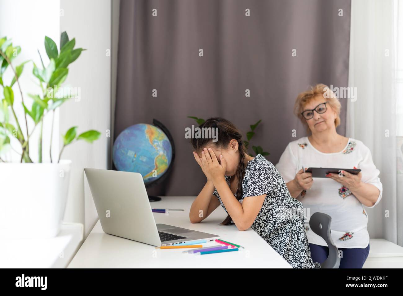 little sad girl and grandmother argue at home Stock Photo - Alamy