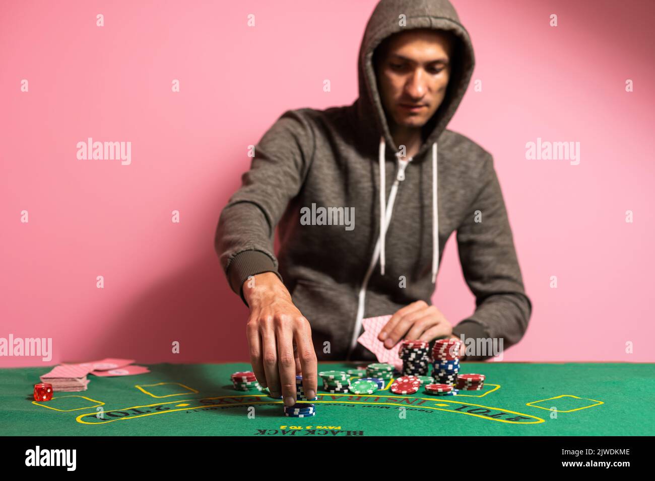 Devastated gambler man losing a lot of money playing poker in casino ...