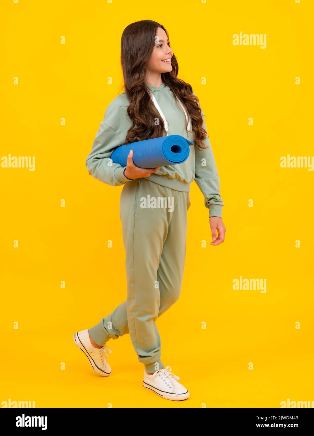 Child girl dressed in sports uniform. Child in a posh stylish sports ...