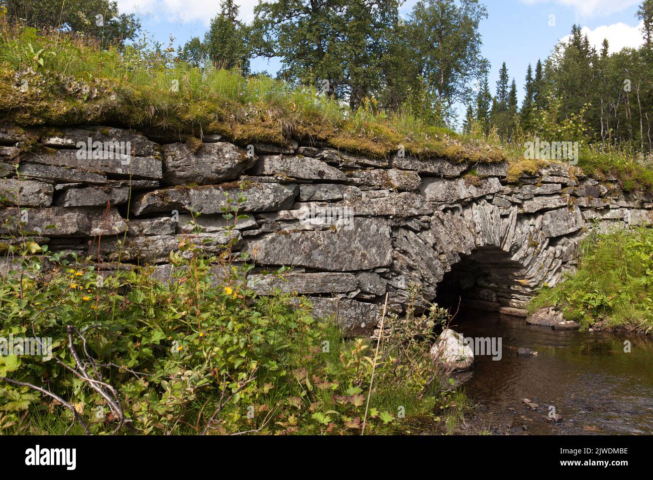 Stone arch bridge on the Pilgrim´s trail St. Olavsleden between Duved ...