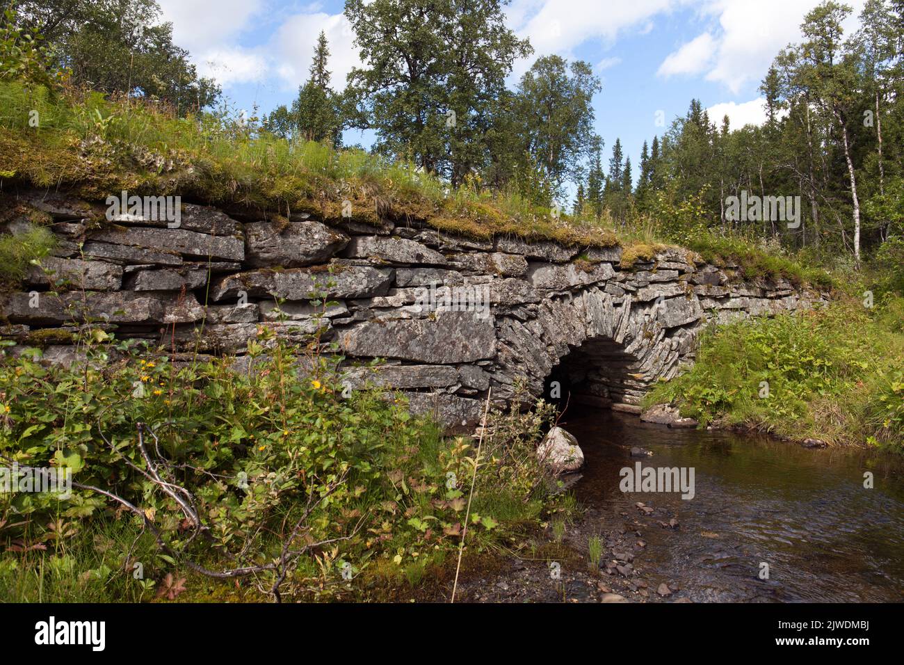Stone arch bridge on the Pilgrim´s trail St. Olavsleden between Duved ...
