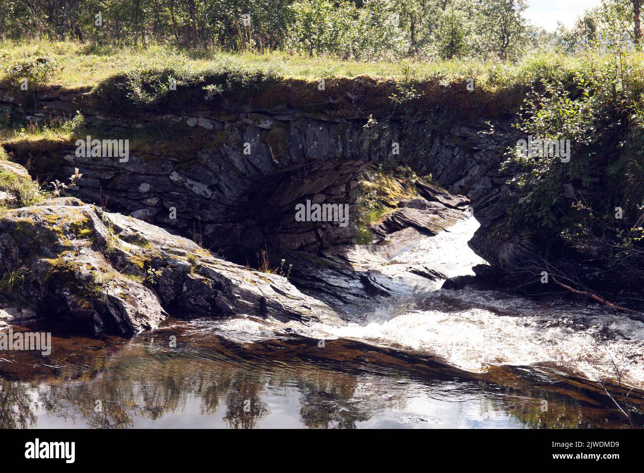 Stone arch bridge on the Pilgrim´s trail St. Olavsleden between Duved ...