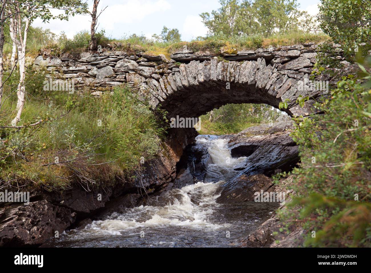 Stone arch bridge on the Pilgrim´s trail St. Olavsleden between Duved ...