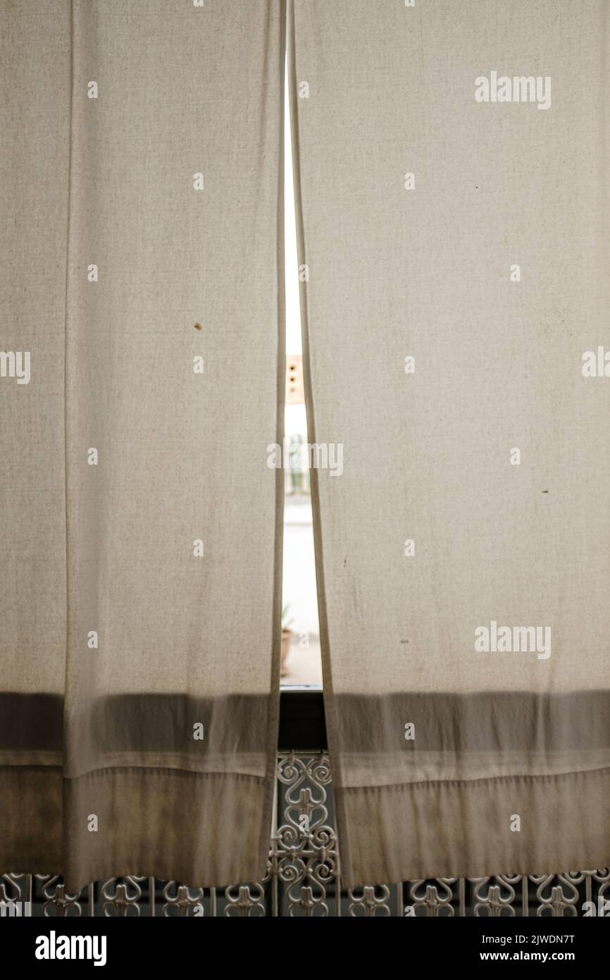 White translucent curtains in a window with narrow view Stock Photo - Alamy